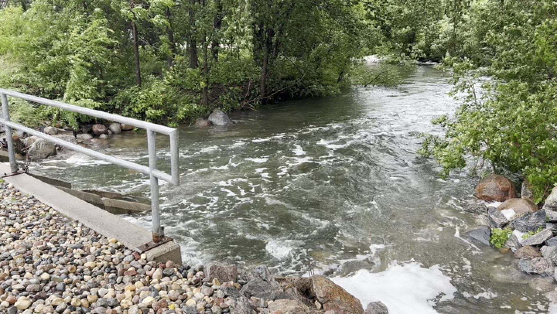 High-water Hawk Creek flowing out of Foot Lake in northwest Willmar ...